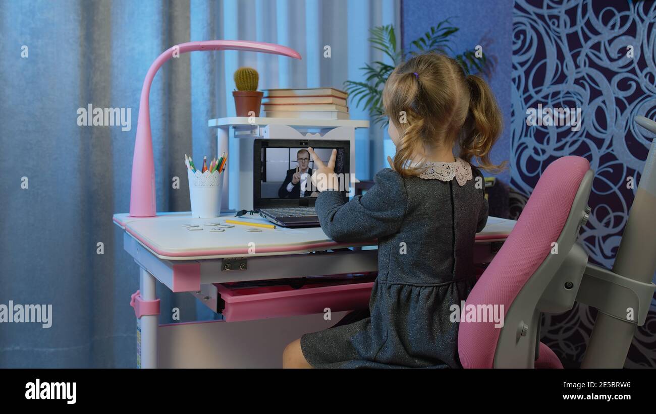 Preschool child girl distance online learning at home. Cute kid pupil ...