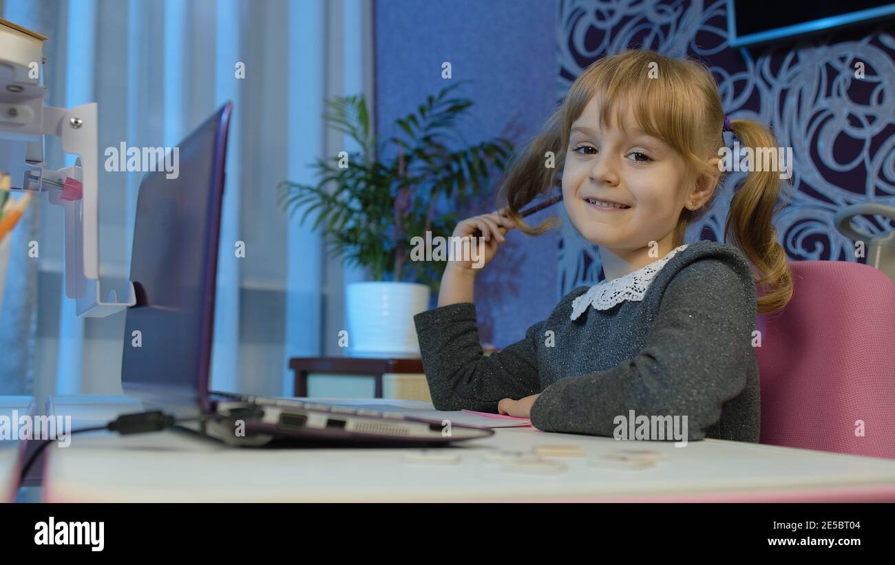 Preschool child girl distance online learning at home. Cute kid pupil ...