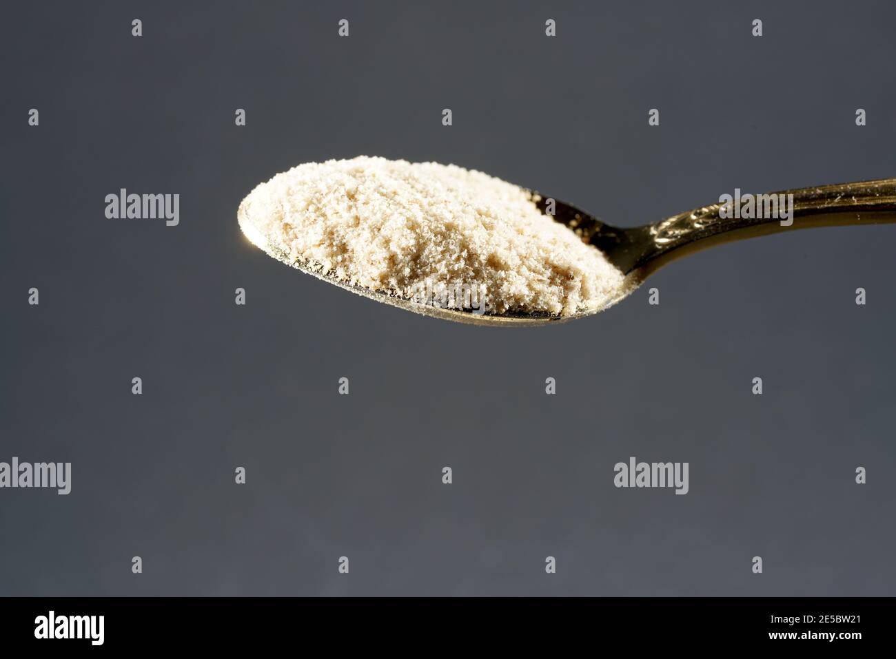 Ground Indian flea seeds photographed in the studio against a black ...