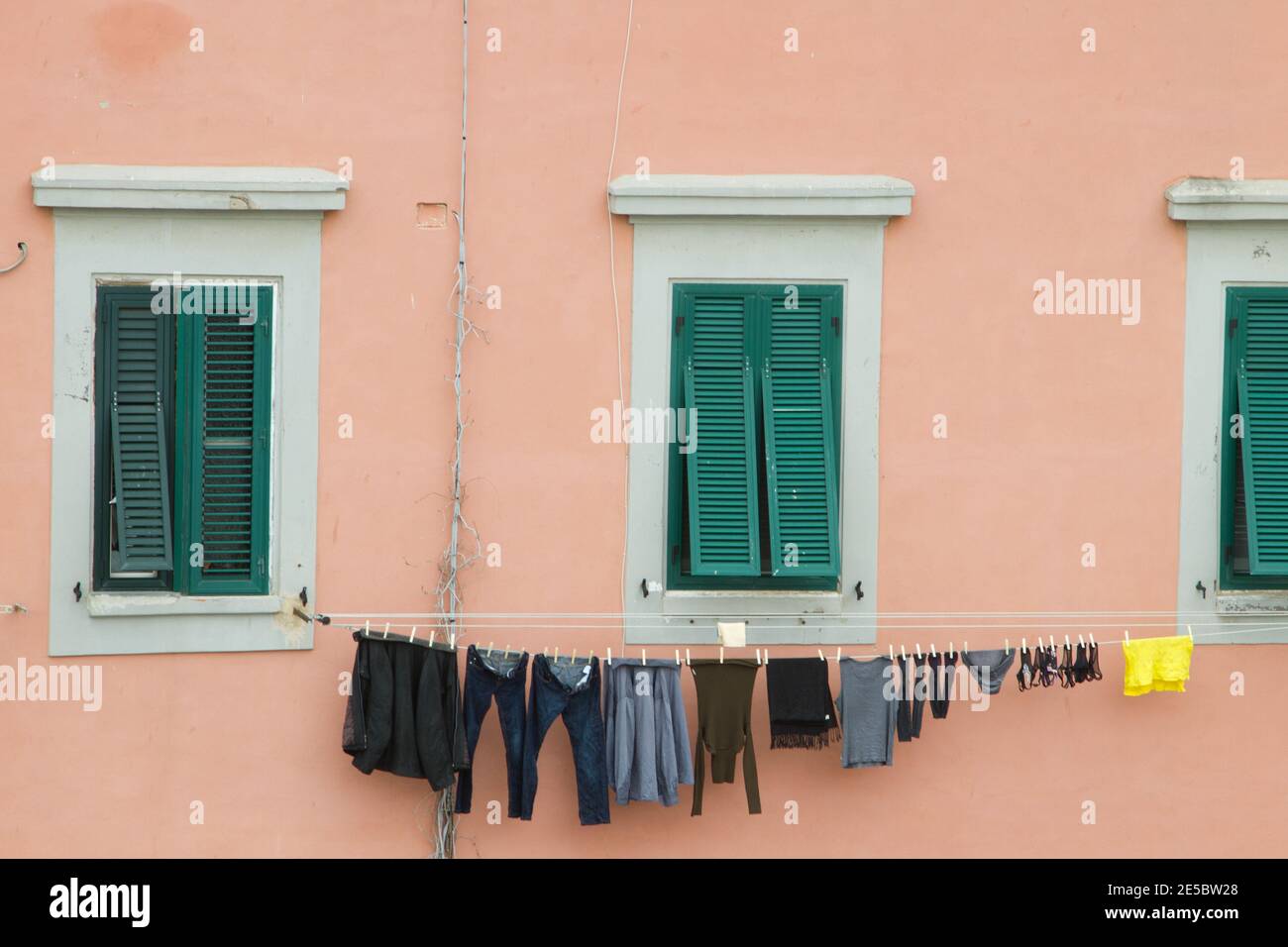 clothes hanging out to dry on a washing line in Livorno on the Ligurian ...
