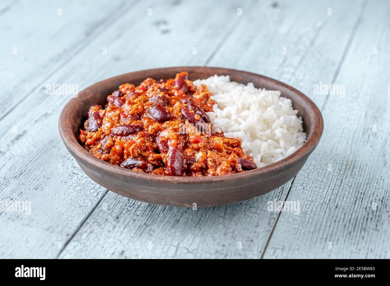 Chili con carne served with white long-grain rice Stock Photo - Alamy