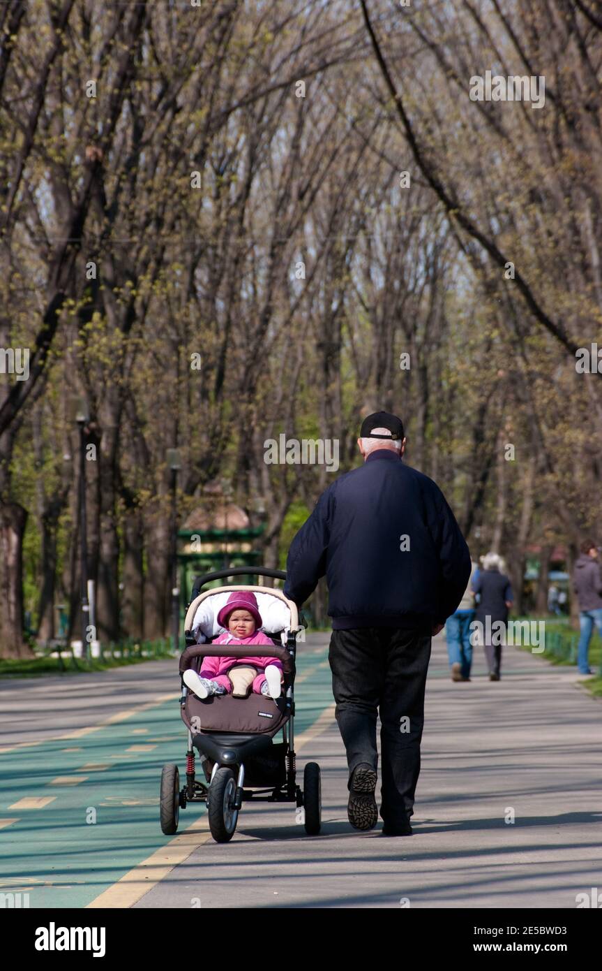 Man pushing child in buggy hi-res stock photography and images - Alamy