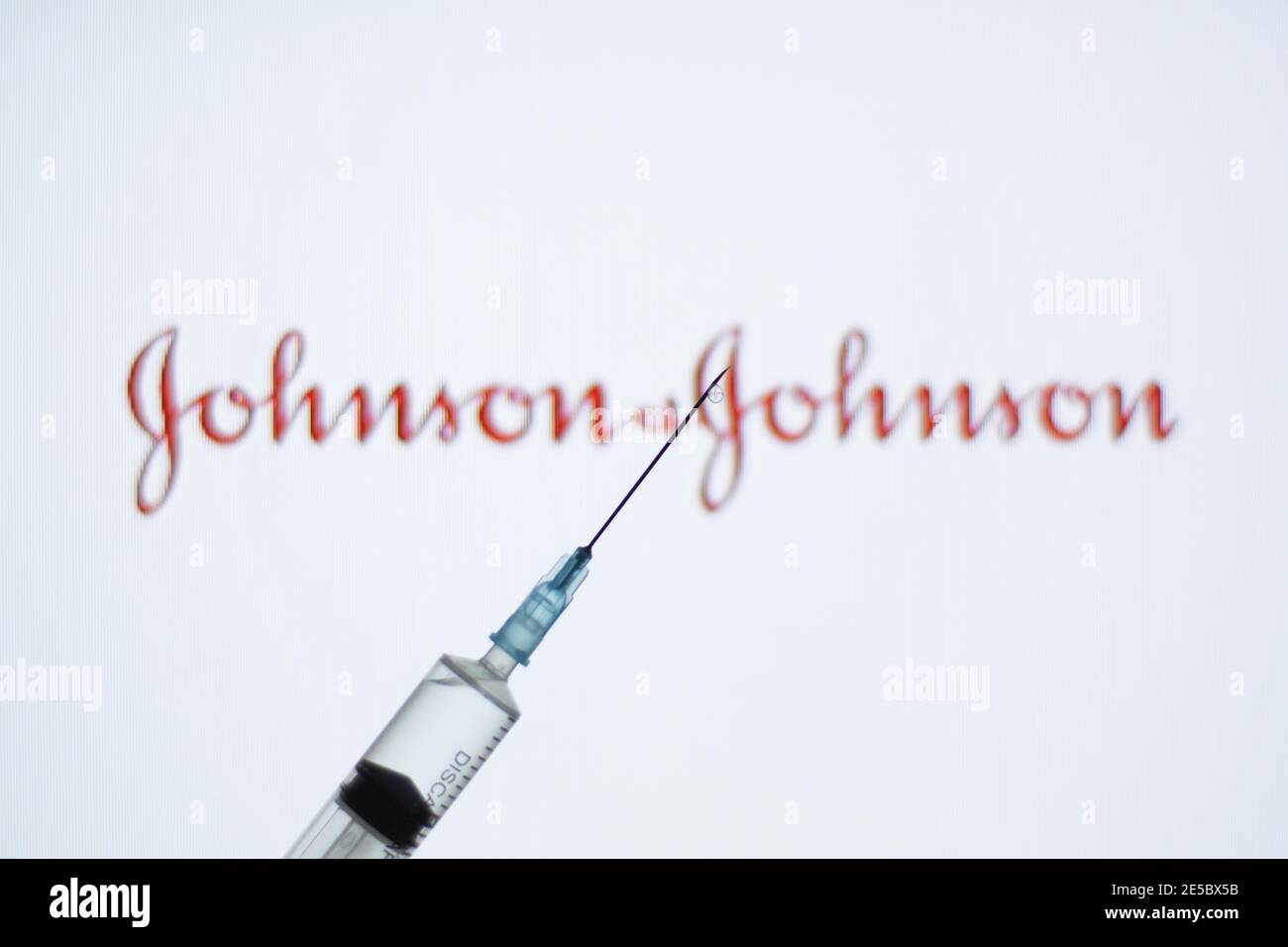 In this photo illustration a medical syringe seen displayed in front of ...