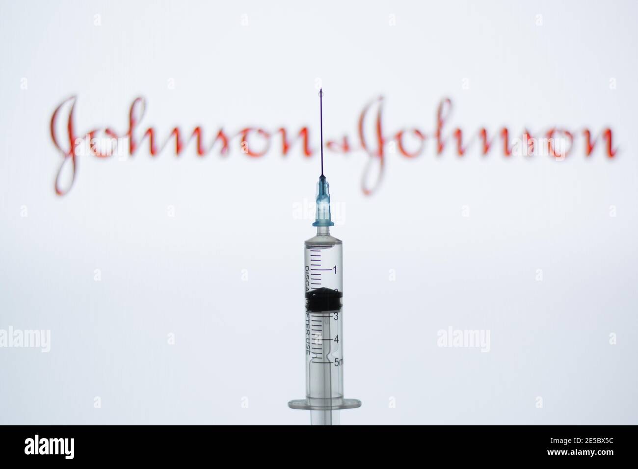 In this photo illustration a medical syringe seen displayed in front of ...