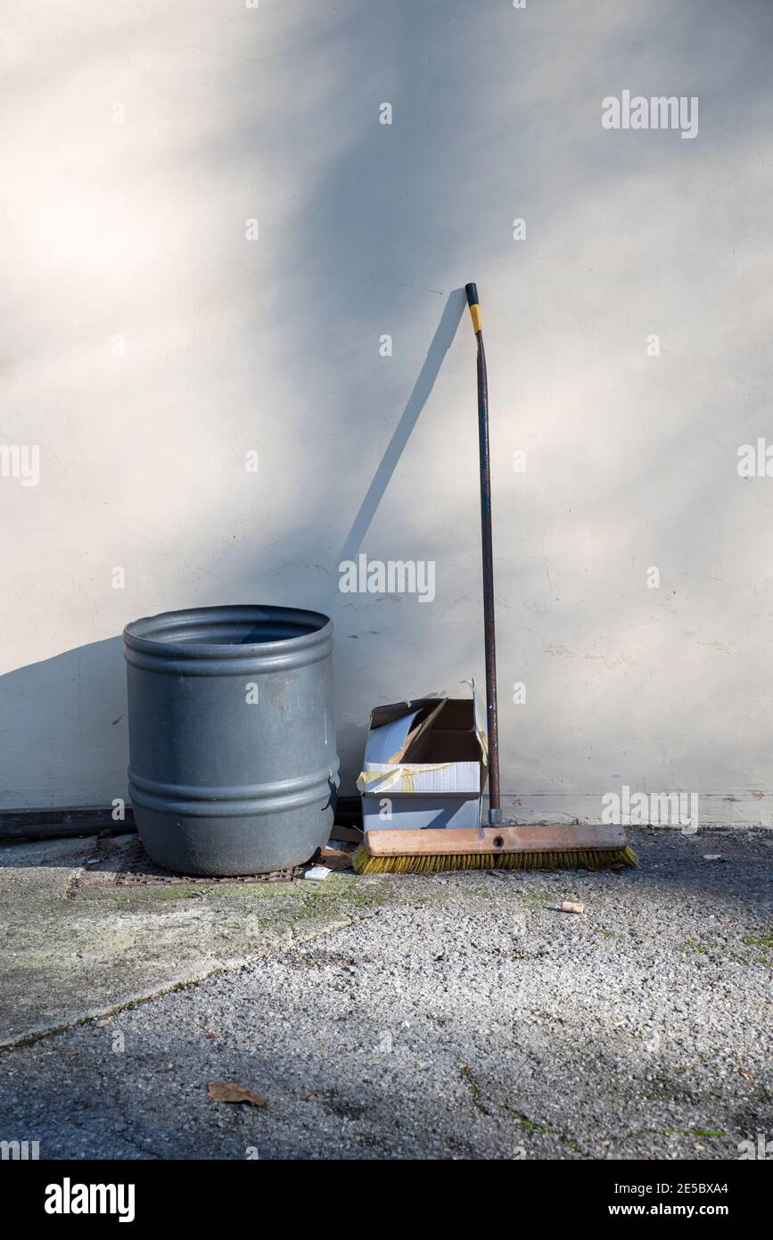 broom and garbage can on the street Stock Photo - Alamy