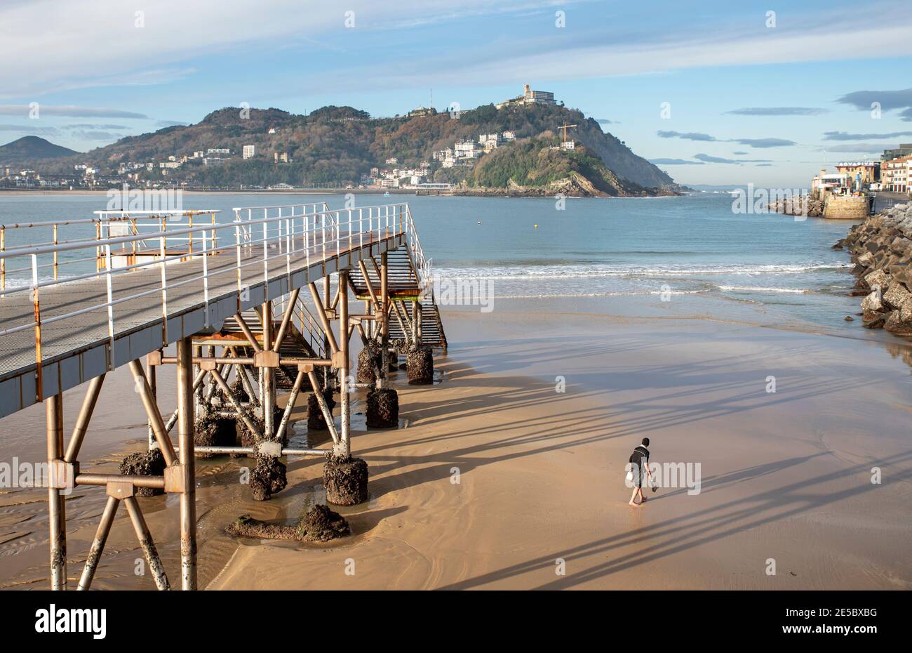 shellfishman taking advantage of the low tide Stock Photo - Alamy