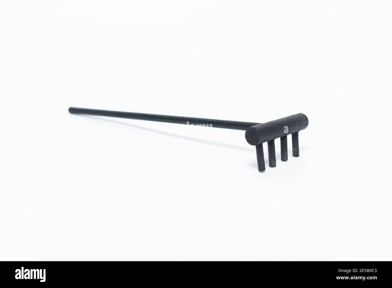 Garden rake isolated on a white background Stock Photo - Alamy