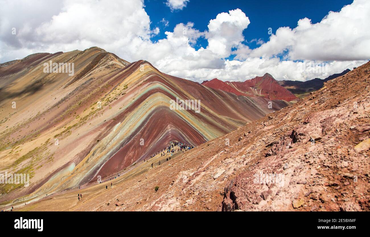 Rainbow mountains or Vinicunca Montana de Siete Colores with people ...