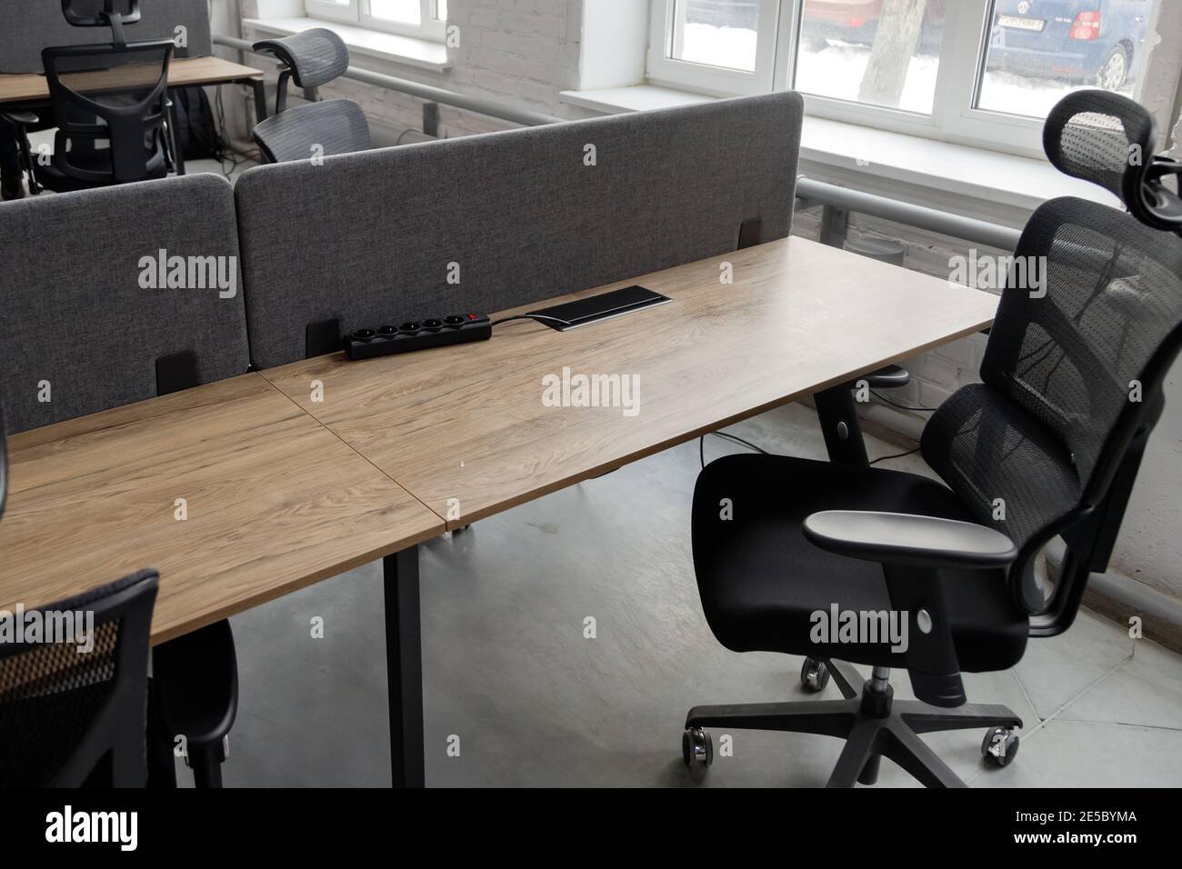 Empty workplace with table and chair at open space office interior ...