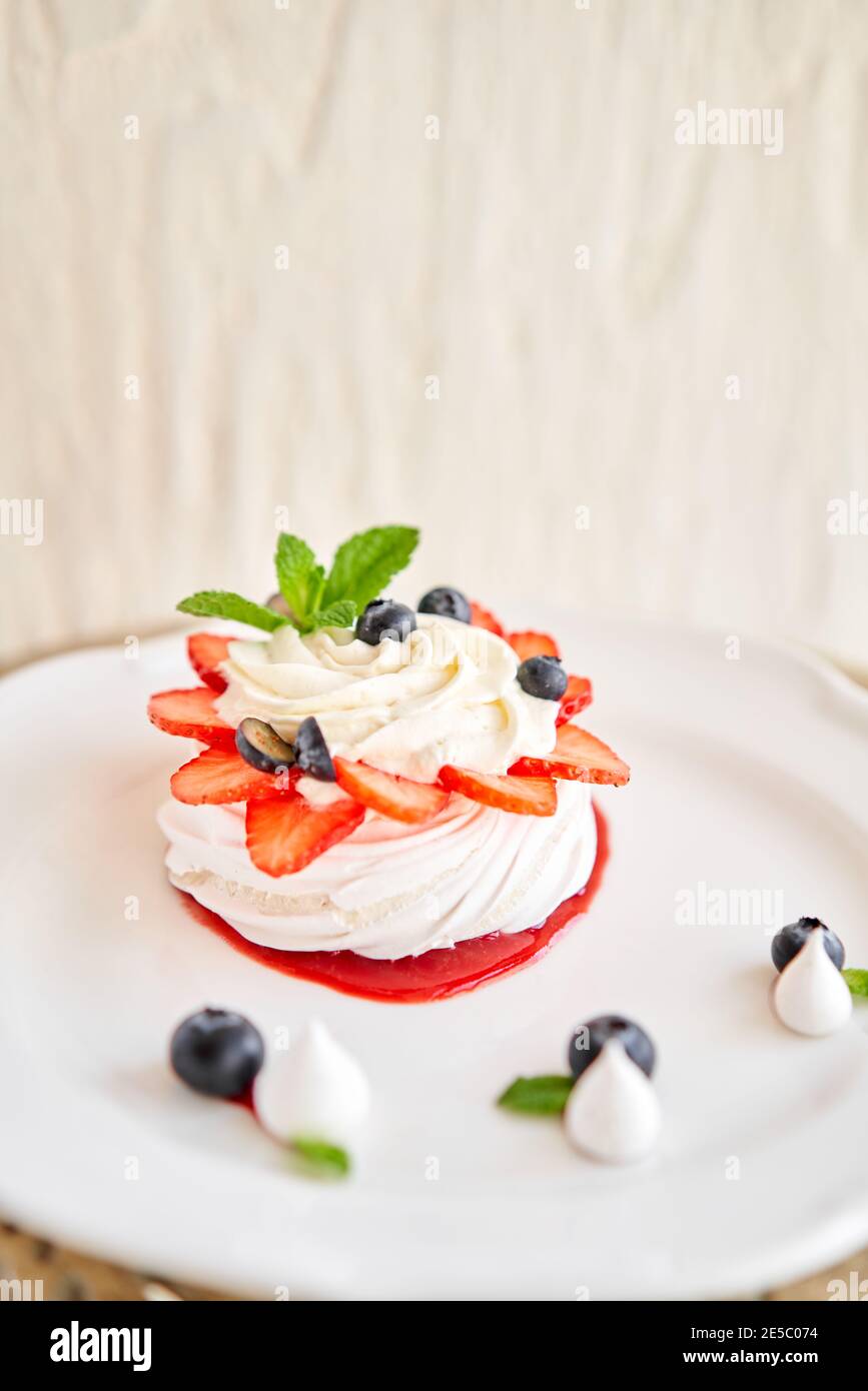 Pavlova is a meringue-based dessert with a crisp crust topped ...