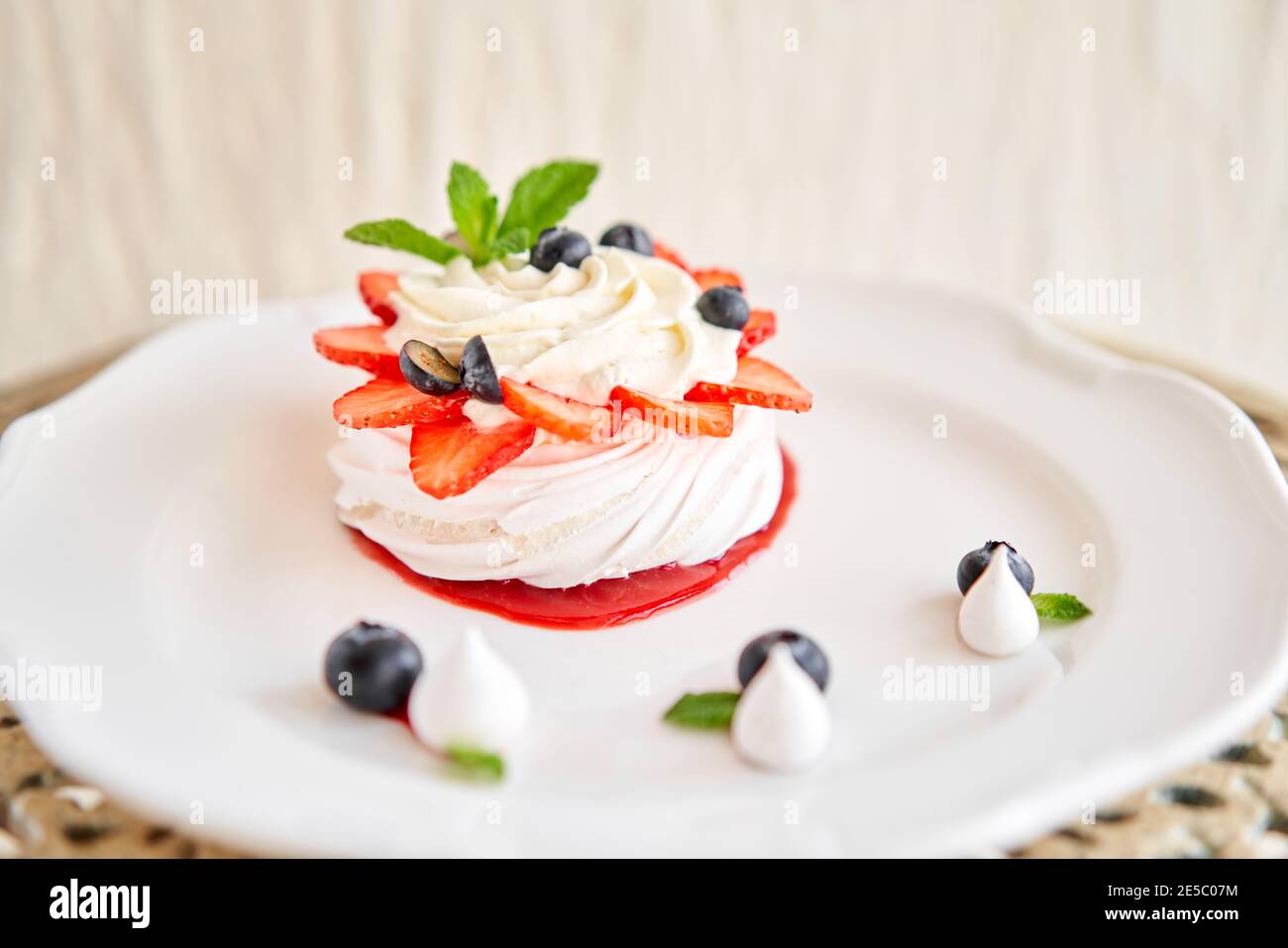 Pavlova is a meringue-based dessert with a crisp crust topped ...
