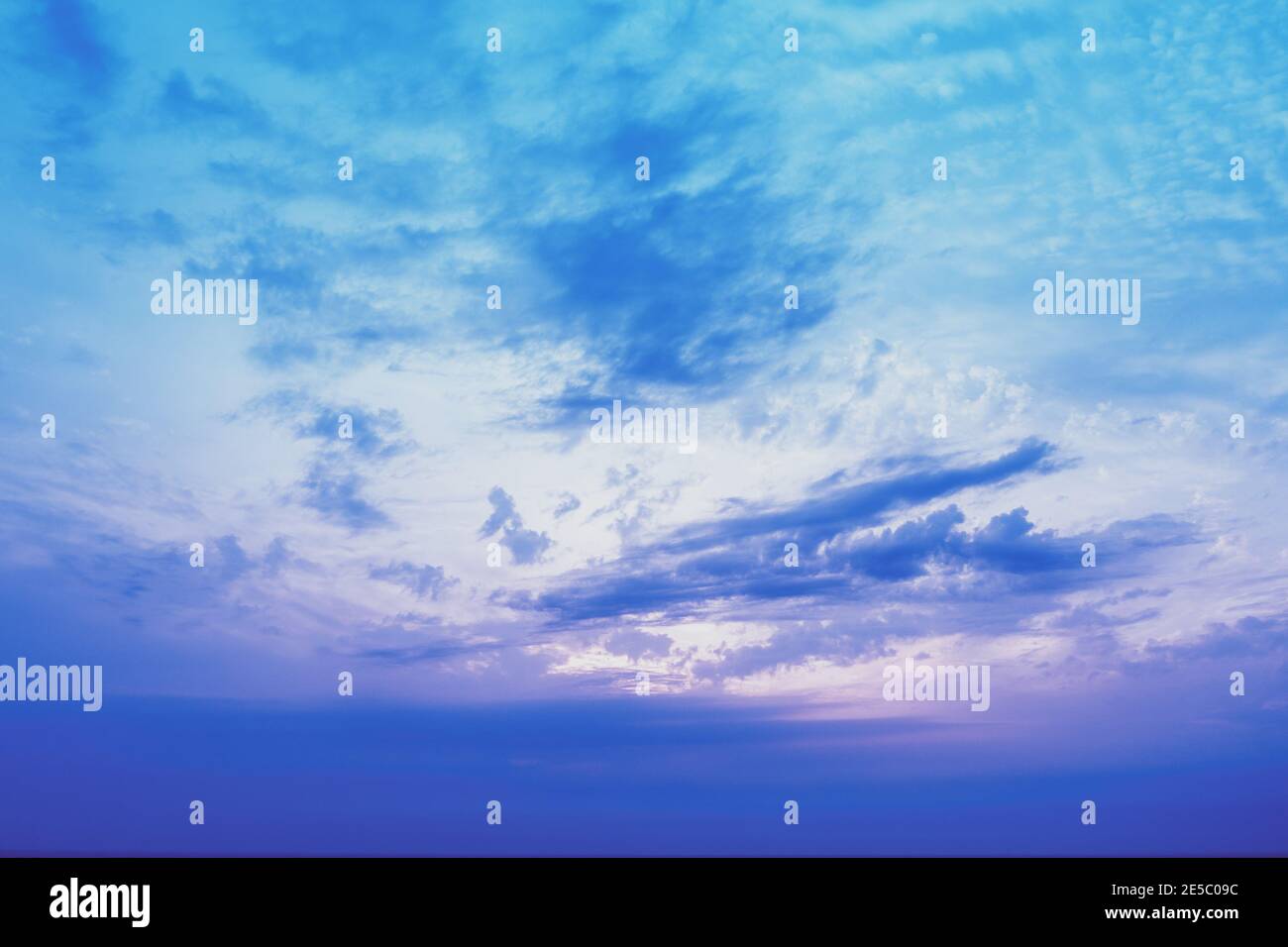 Colorful cloudy sky at sunset over the countryside. Gradient color ...