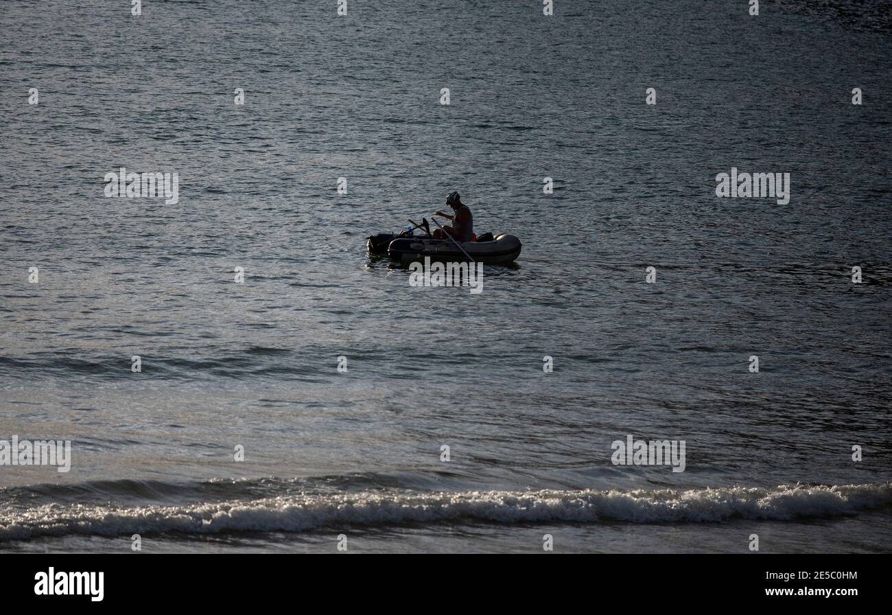 person rowing in his boat Stock Photo - Alamy