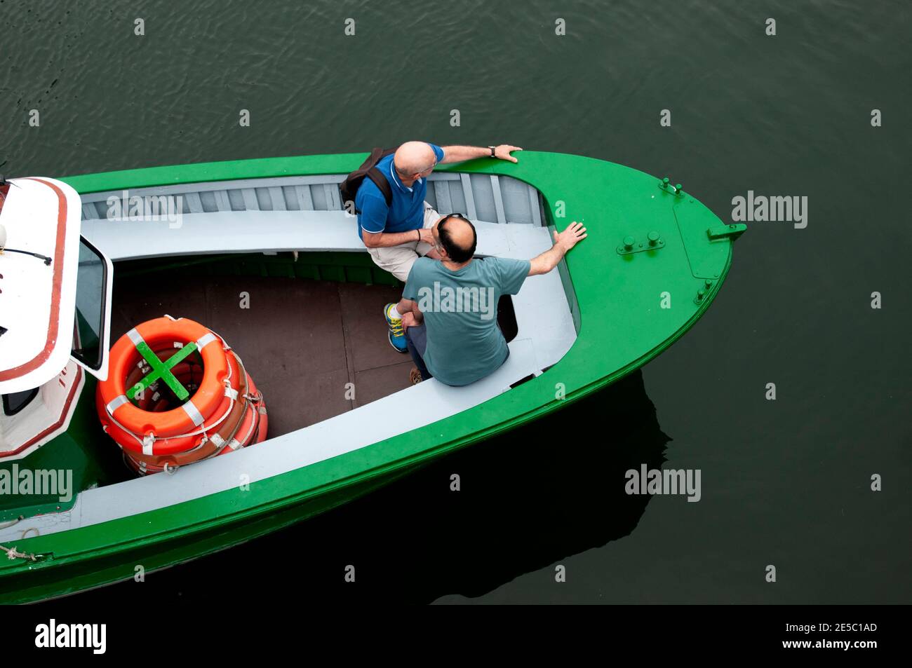 Men sailing on a boat Stock Photo - Alamy