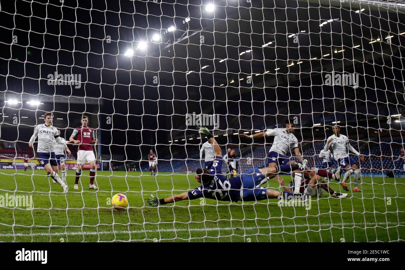 Burnley's Dwight McNeil scoring their sides second goal past Aston ...