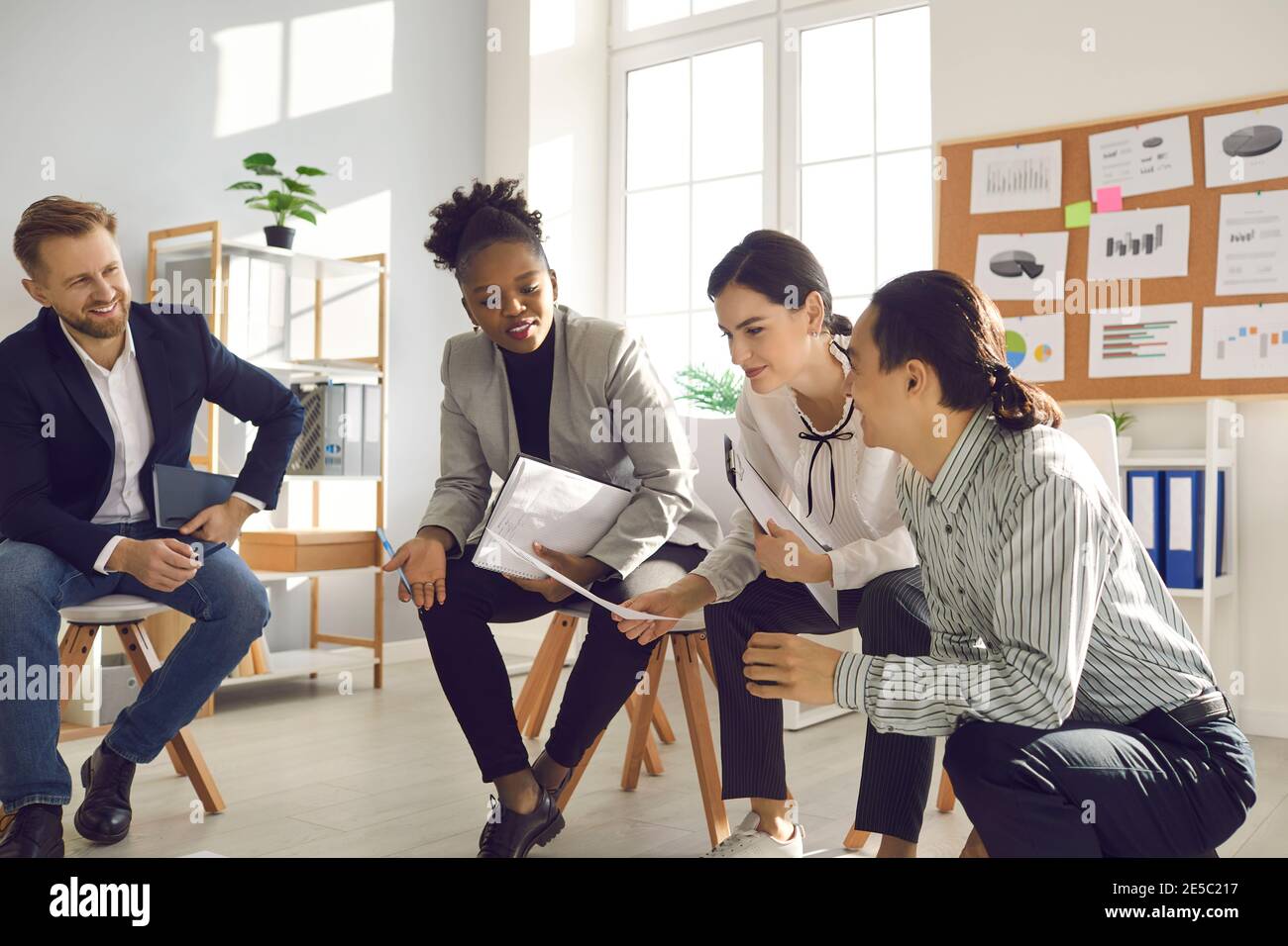 Team of business people working on project, discussing ideas, making ...