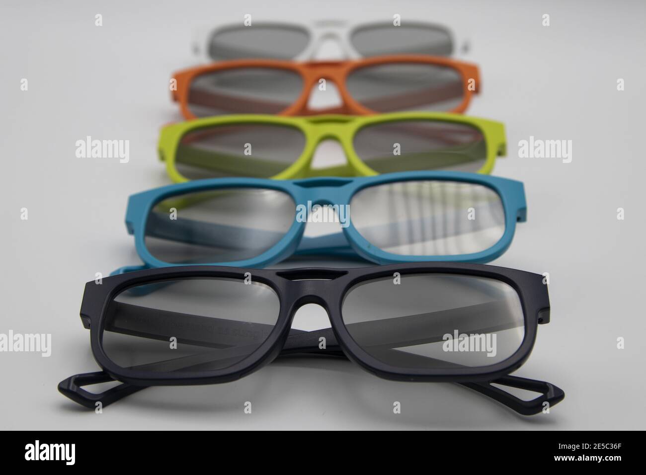 Set of colorful sunglasses on a light-colored background Stock Photo ...