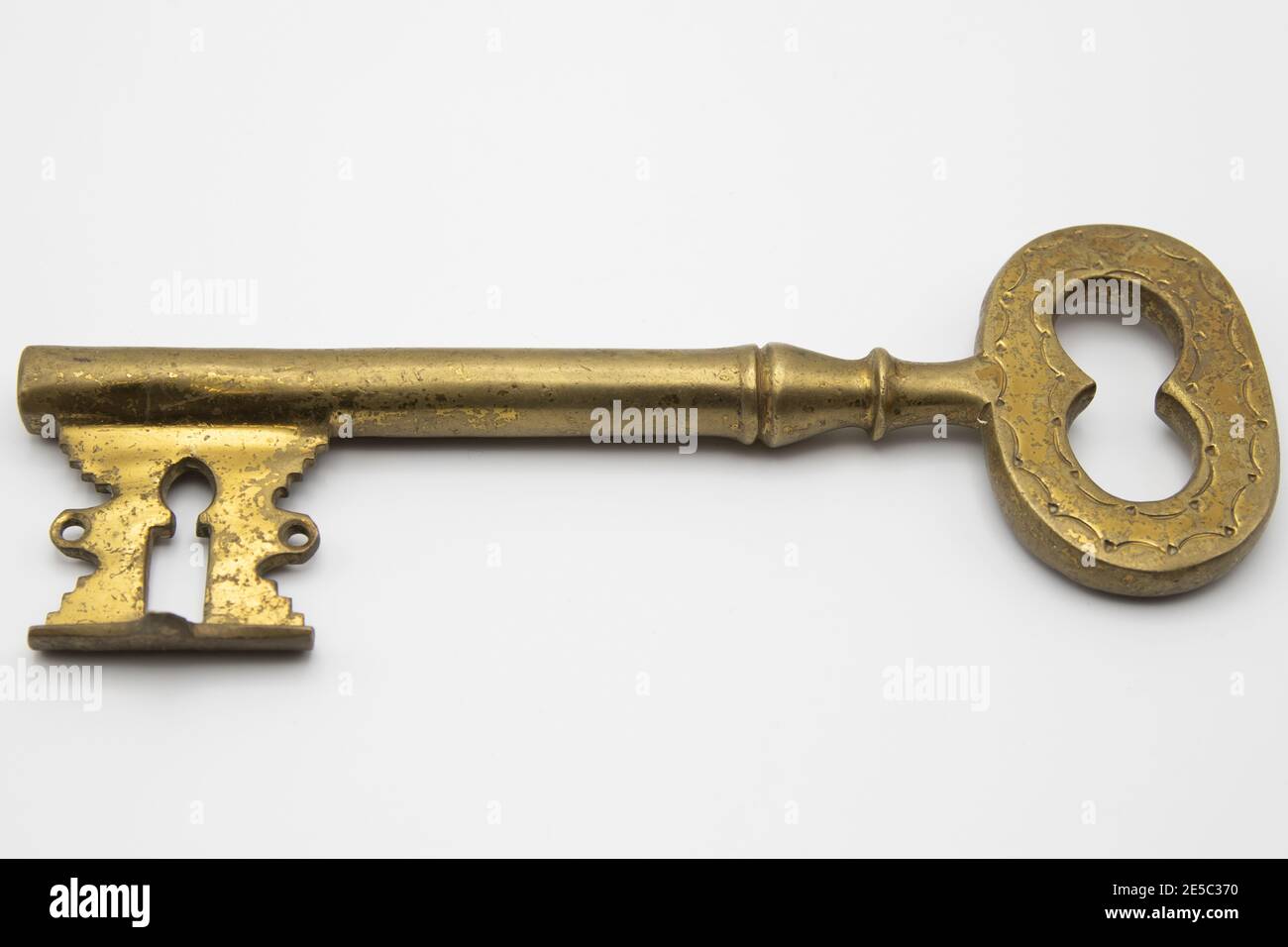 Vintage golden key isolated on a white background Stock Photo - Alamy