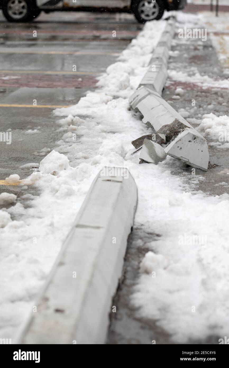 Damaged parking block Stock Photo - Alamy