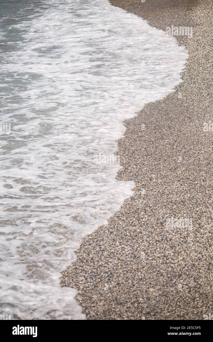 The beach of the Mediterranean coast with waves of azure water. Summer ...