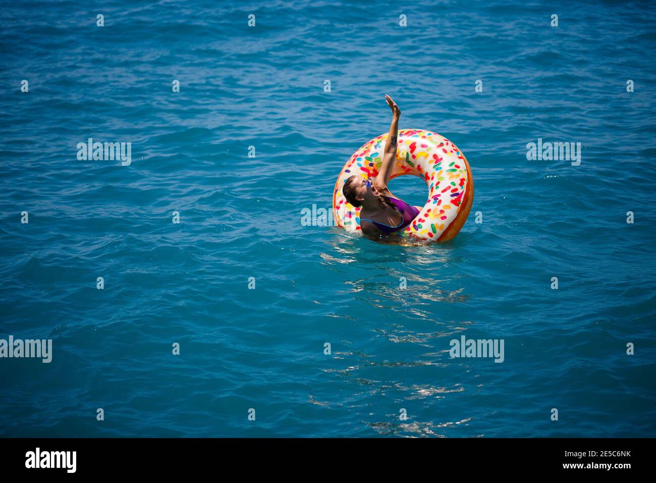 Woman floating in inner tube hi-res stock photography and images - Alamy