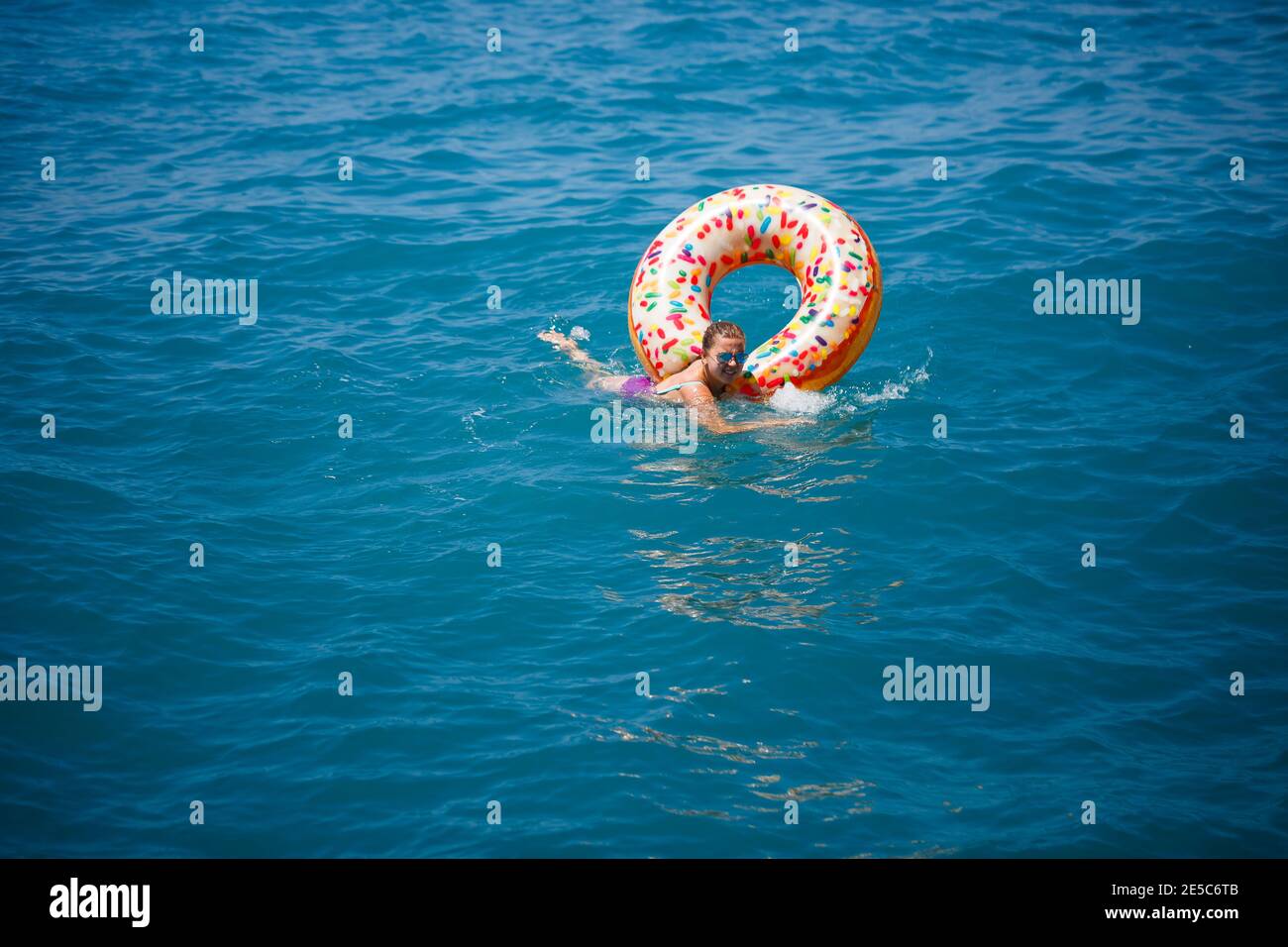 Woman floating in inner tube hi-res stock photography and images - Alamy