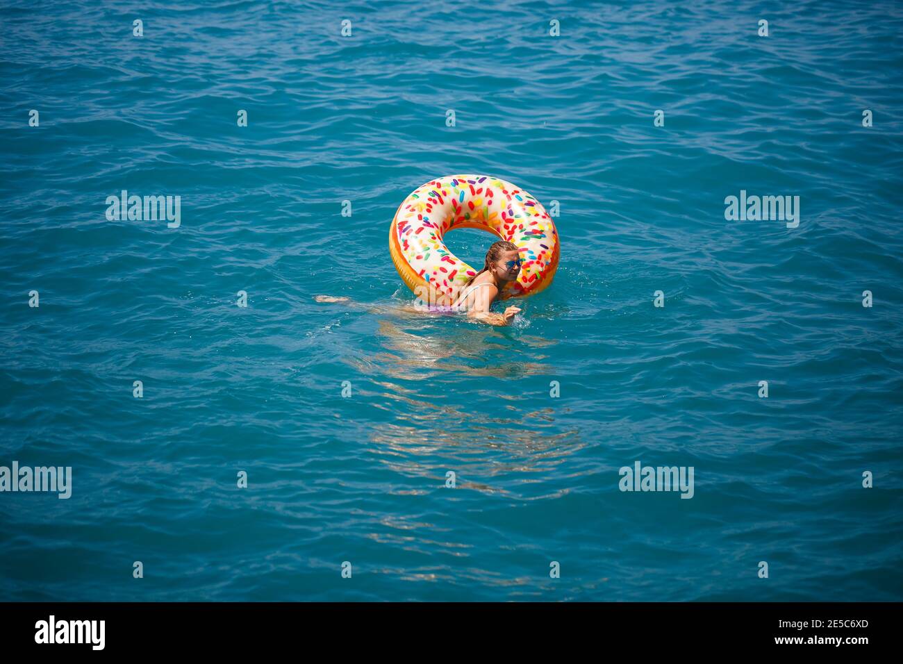 Woman floating in inner tube hi-res stock photography and images - Alamy