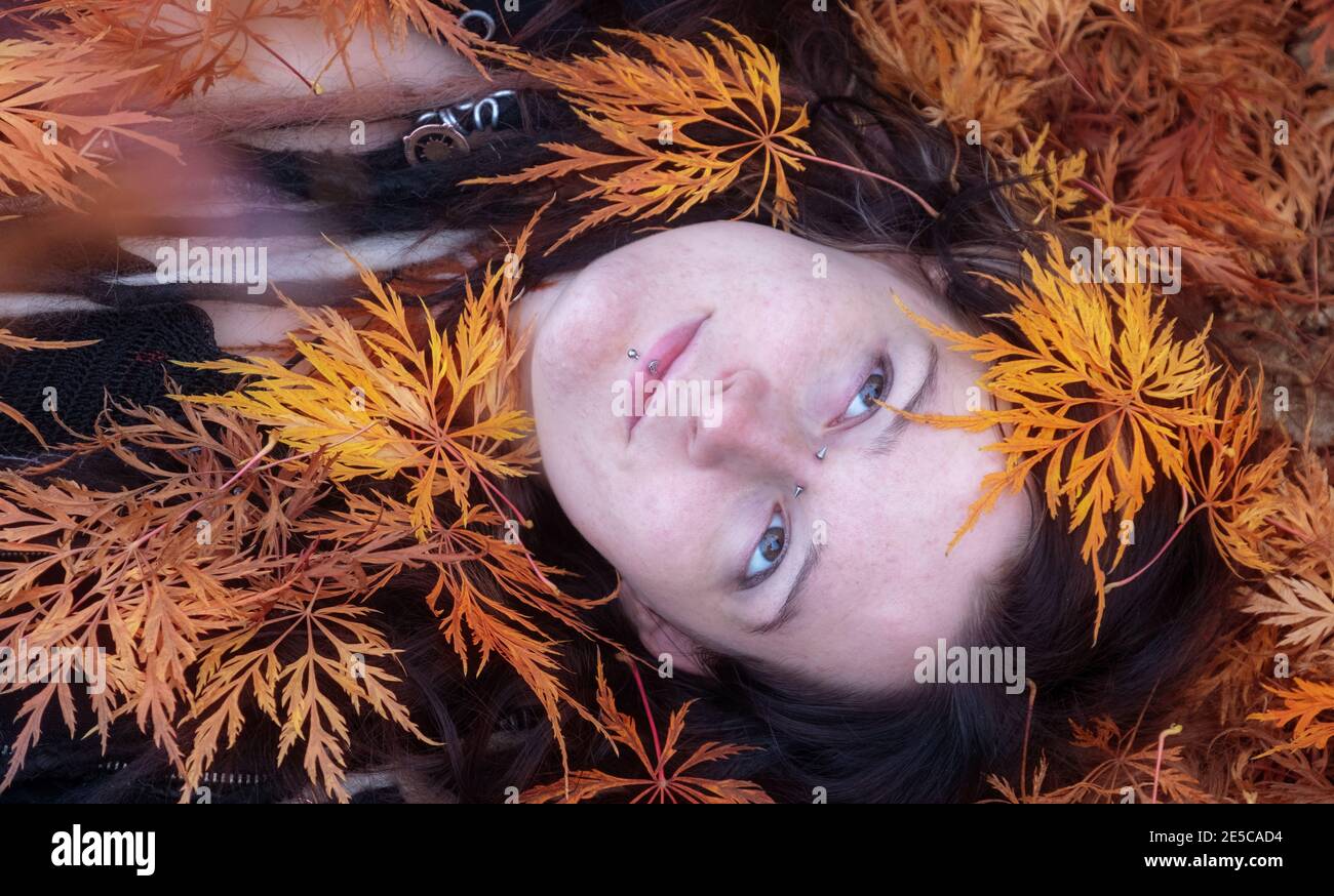 Beautiful young individual, eccentric woman, with interesting hairstyle ...