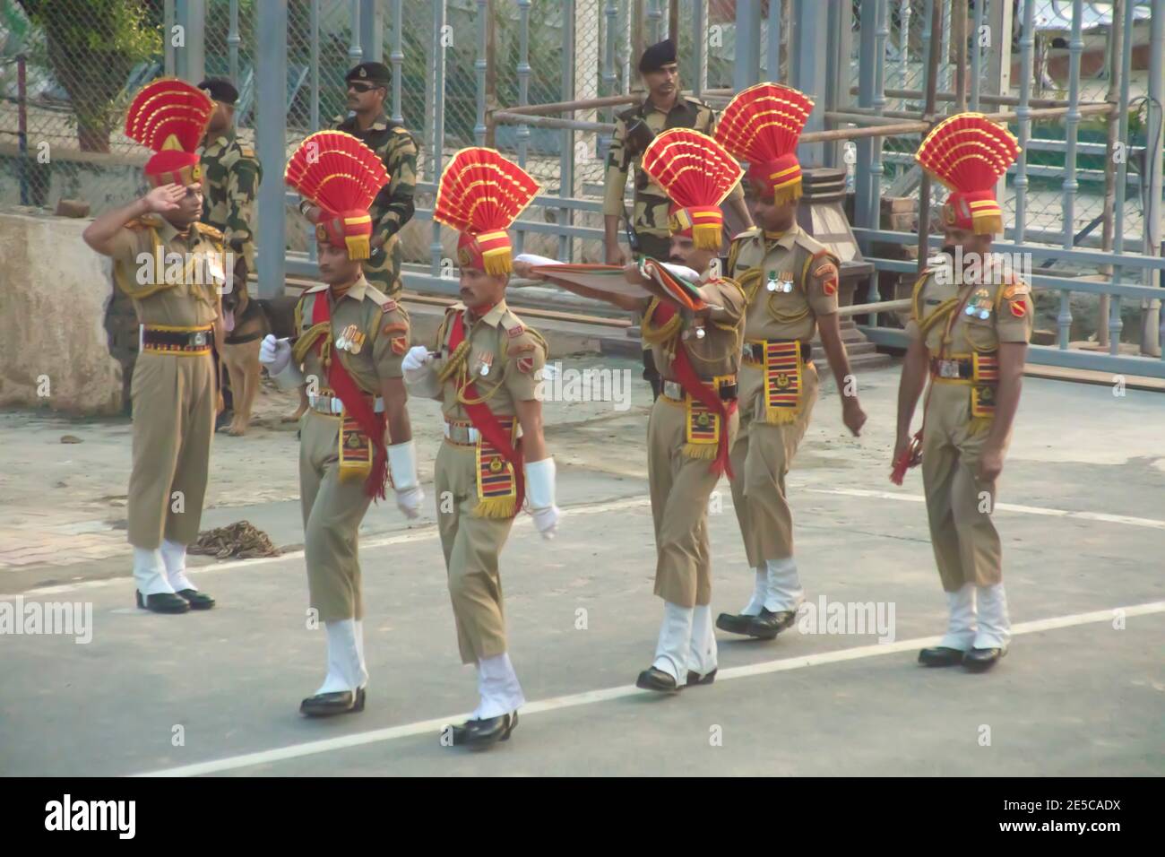 Indian soldiers with national flag at flag-lowering ceremony Attari ...