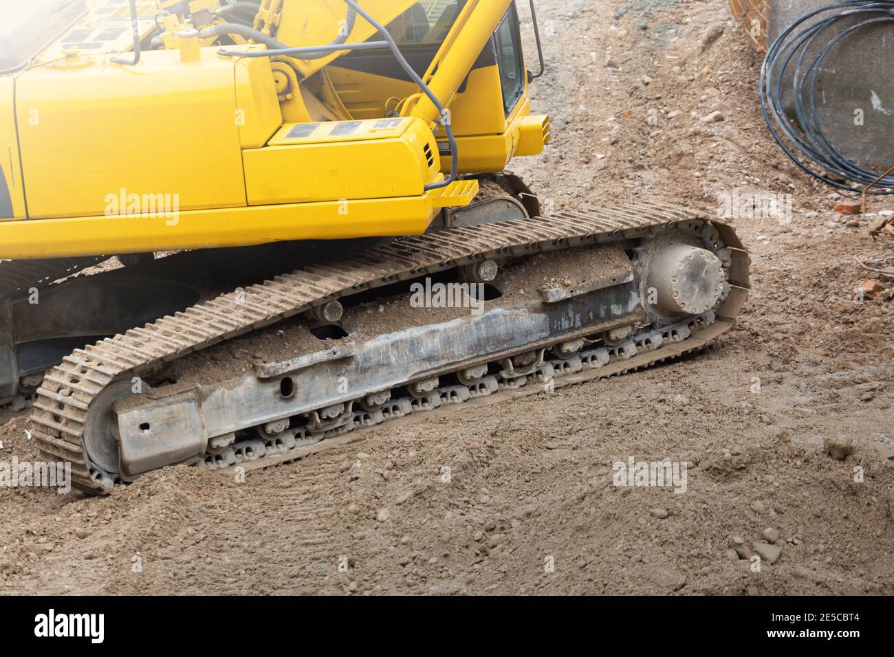 Workers building on construction site with excavator Stock Photo - Alamy