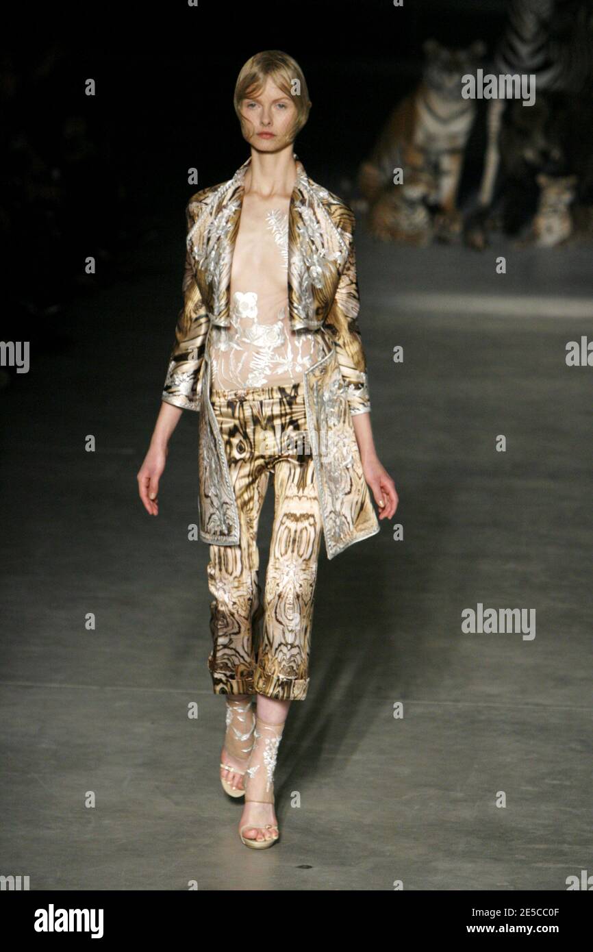 A model presents a creation by designer Alexander Mc Queen as part of ...