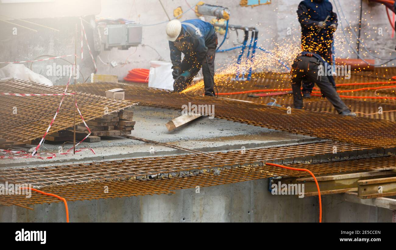 Workers building on construction site with steel and cement Stock Photo ...