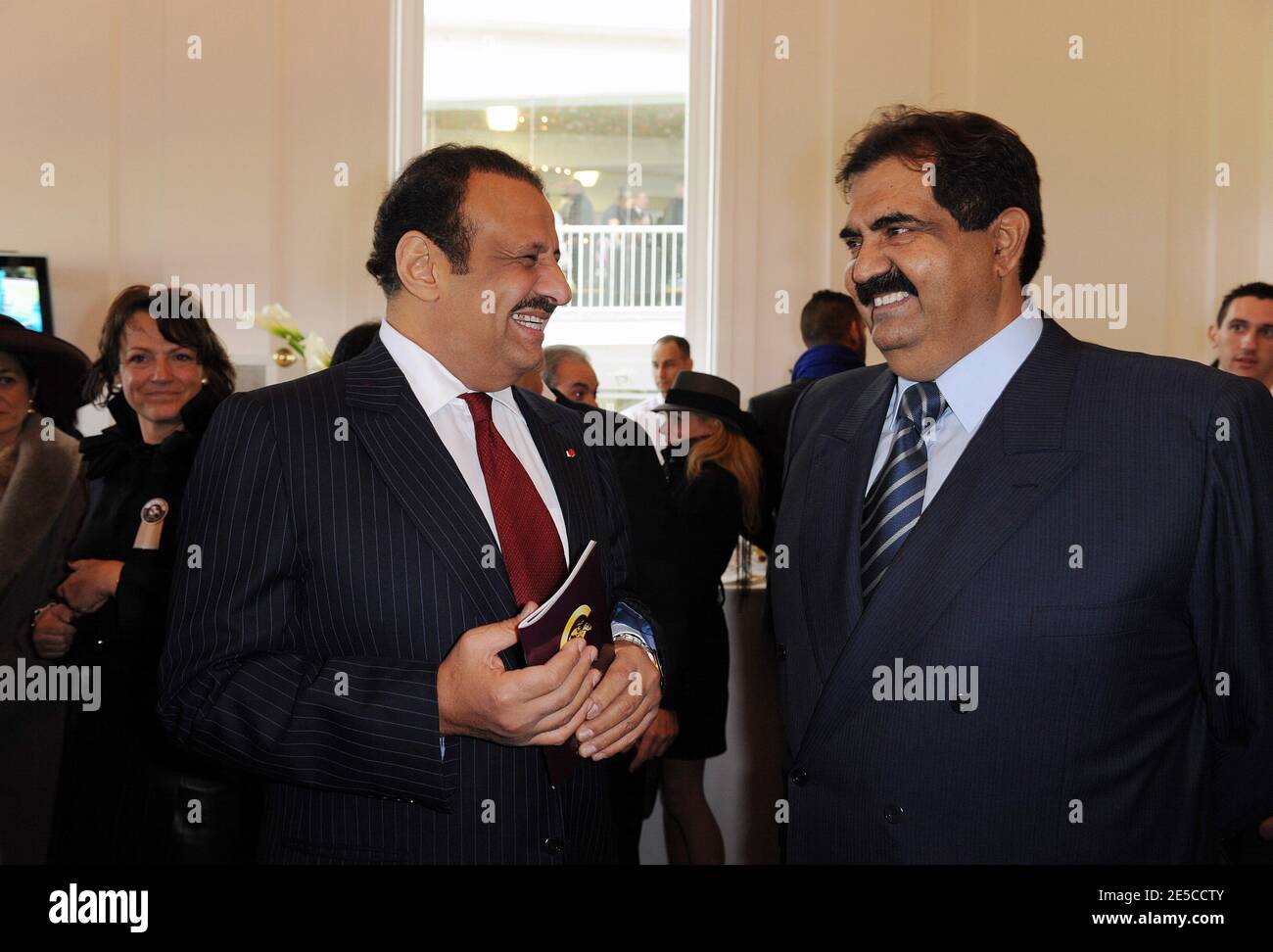 Qatar's Emir Sheikh Hamad Bin Khalifa Al Thani (R) is seen next to ...