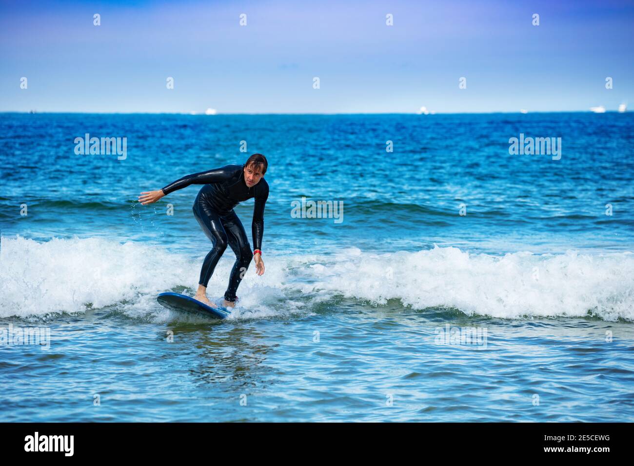 Children surfing waves blue hi-res stock photography and images - Alamy