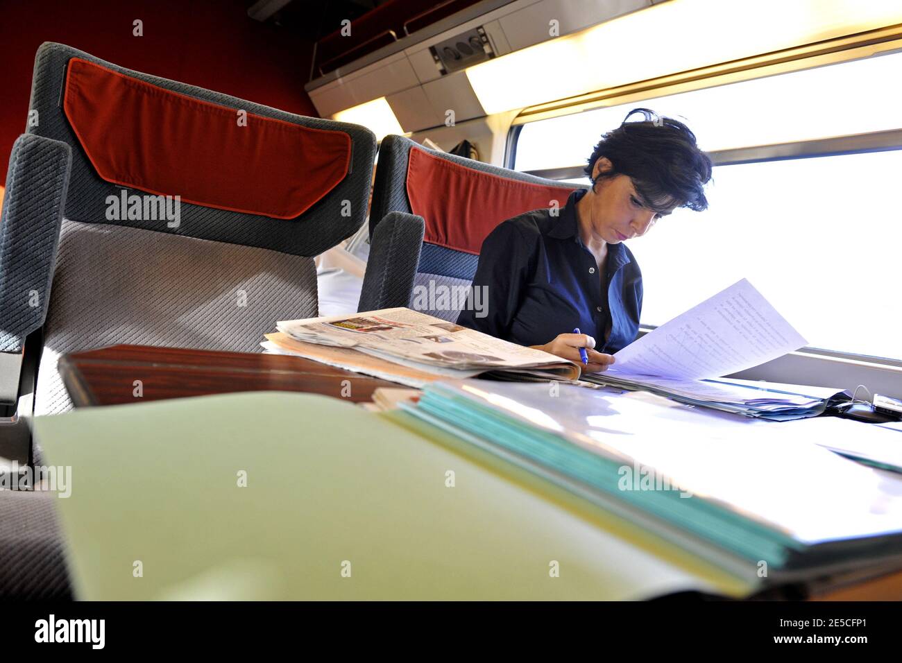 Justice Minister Rachida Dati works in a TGV train on her way to ...