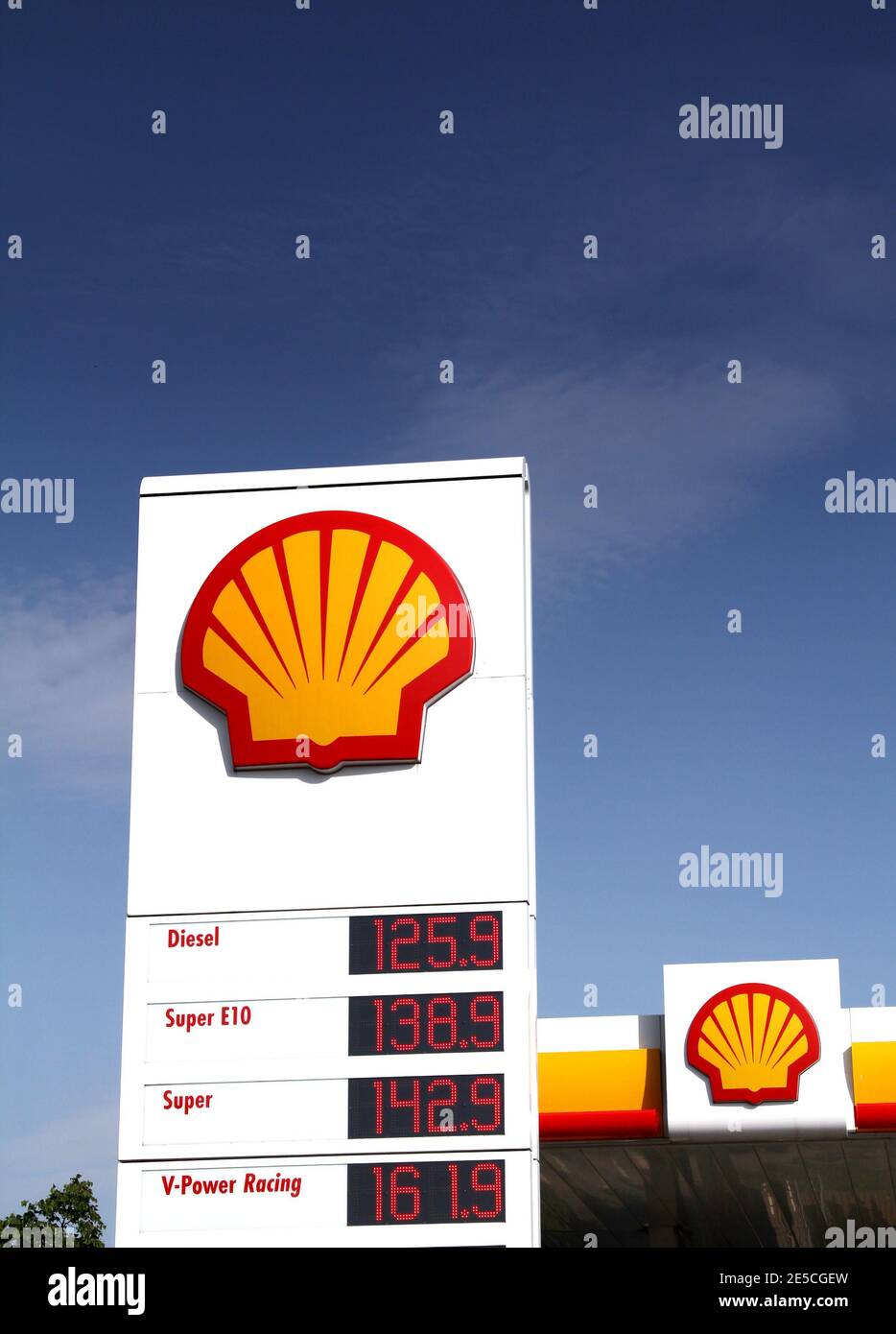 Shell sign against blue sky. Shell is an Anglo-Dutch multinational oil ...