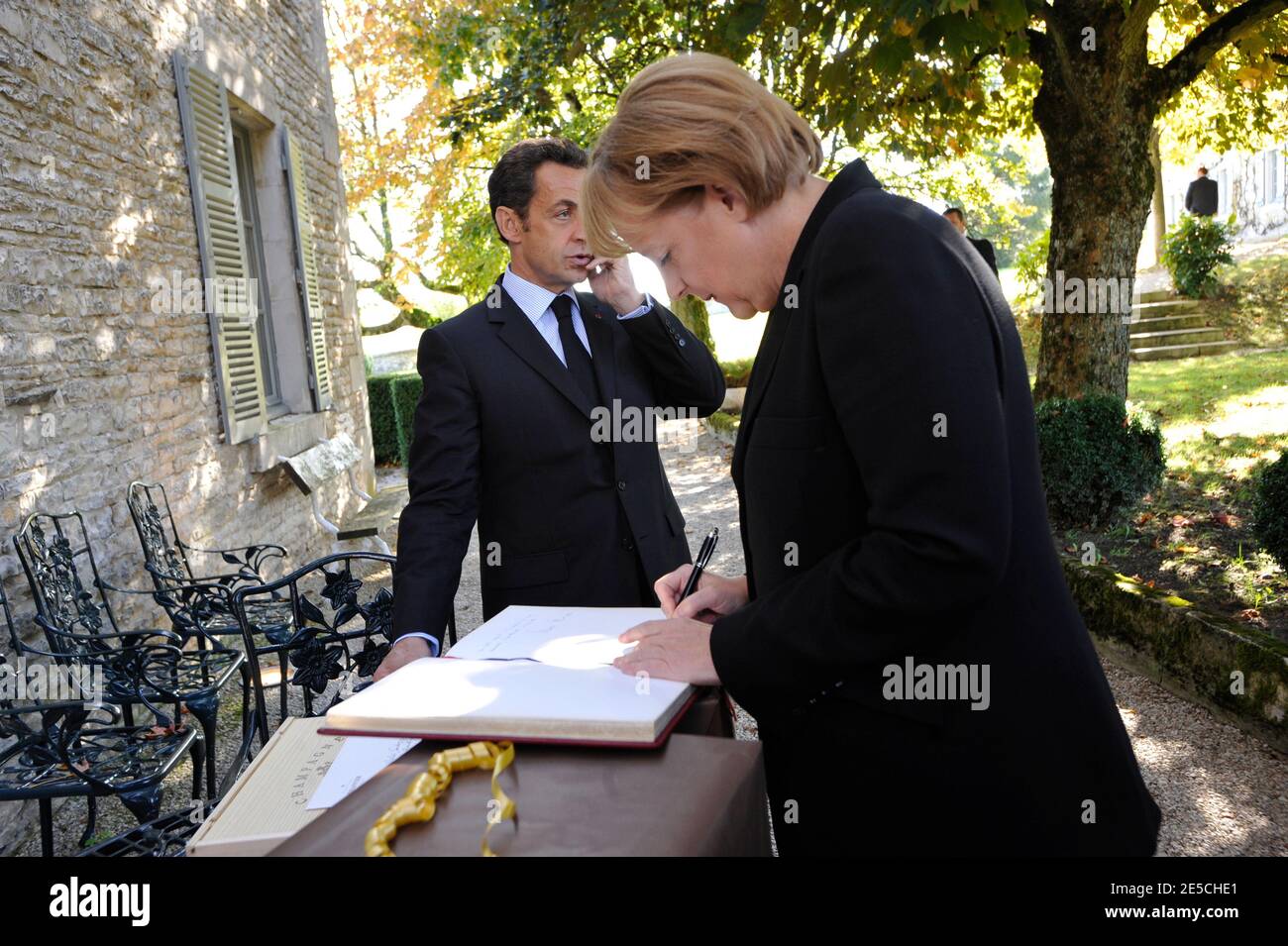 French President Nicolas Sarkozy and German Chancellor Angela Merkel ...