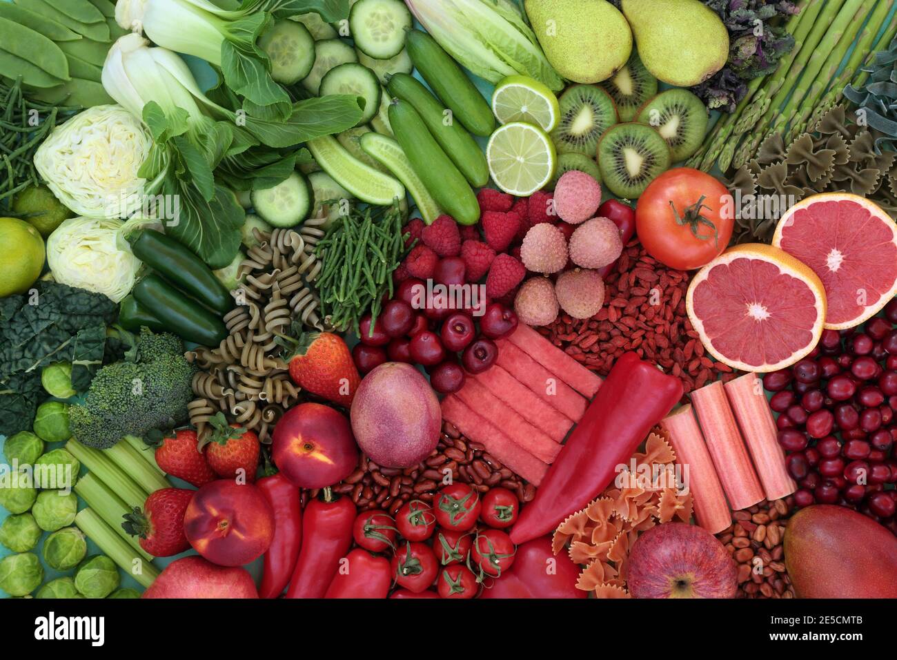 Red & green high fibre food for gut health concept with fruit ...