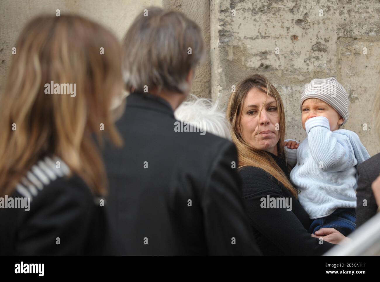 Mathilde Seigner with son Louis attend the funeral of Francoise Seigner ...