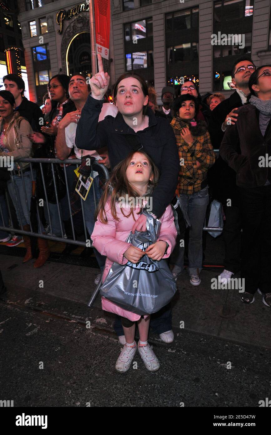 Tourists Eibhlis Lucey and daughter Shannon Lucey watch the 2008 ...