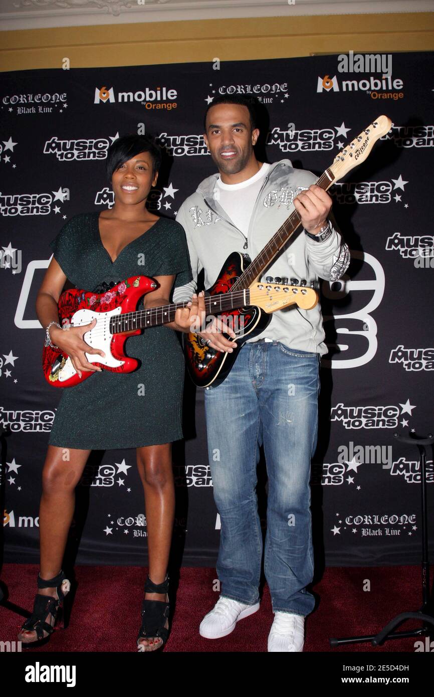 Singers Craig David and Estelle pose with guitars designed by Corleone ...