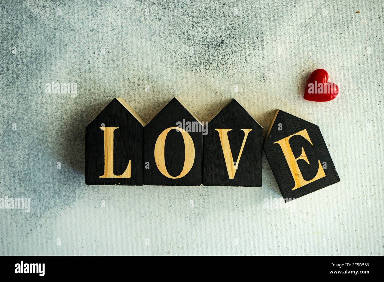 Word LOVE written with wooden blocks and a heart shape decoration Stock ...