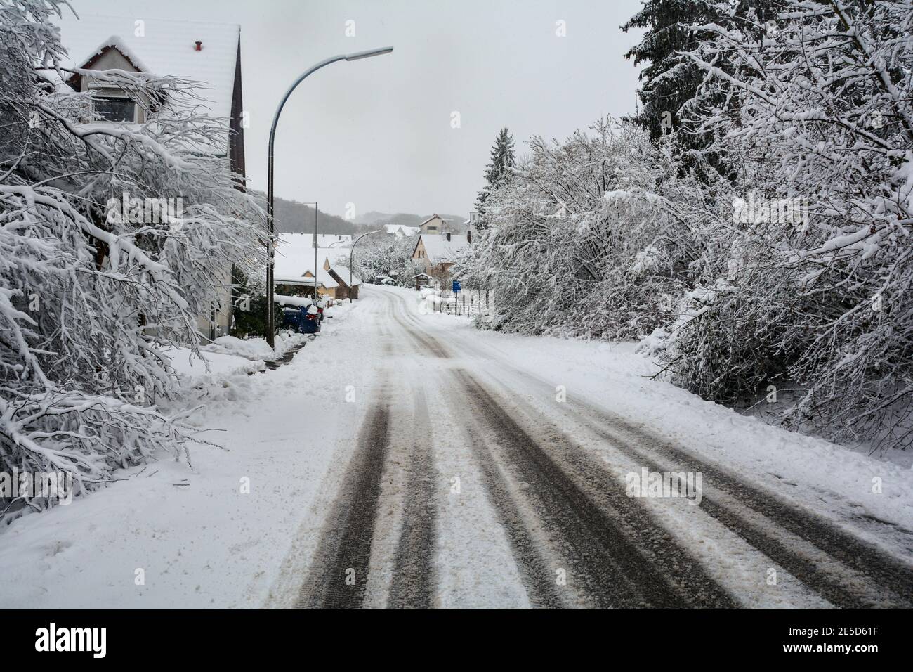Country road with a lot of snow to the village Krombach in Spessart ...