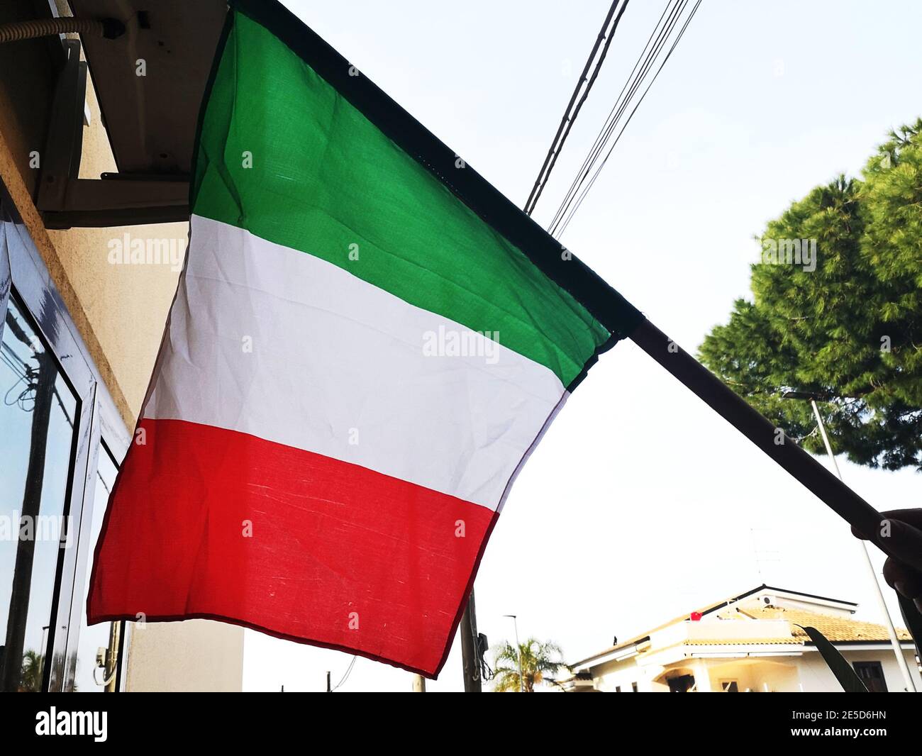 Hand holding flag hi-res stock photography and images - Alamy