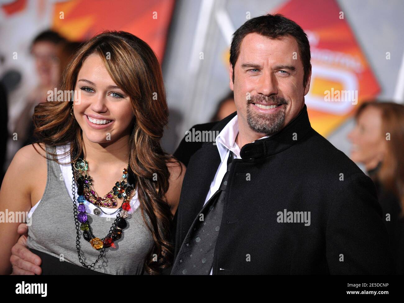 Cast members Miley Cyrus and John Travolta attend the World Premiere of ...