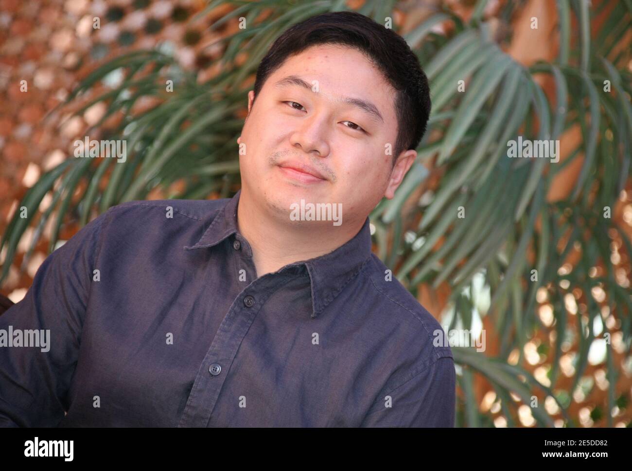 Director Zhang Chi poses at the photocall of 'The Shaft' during the 8th ...