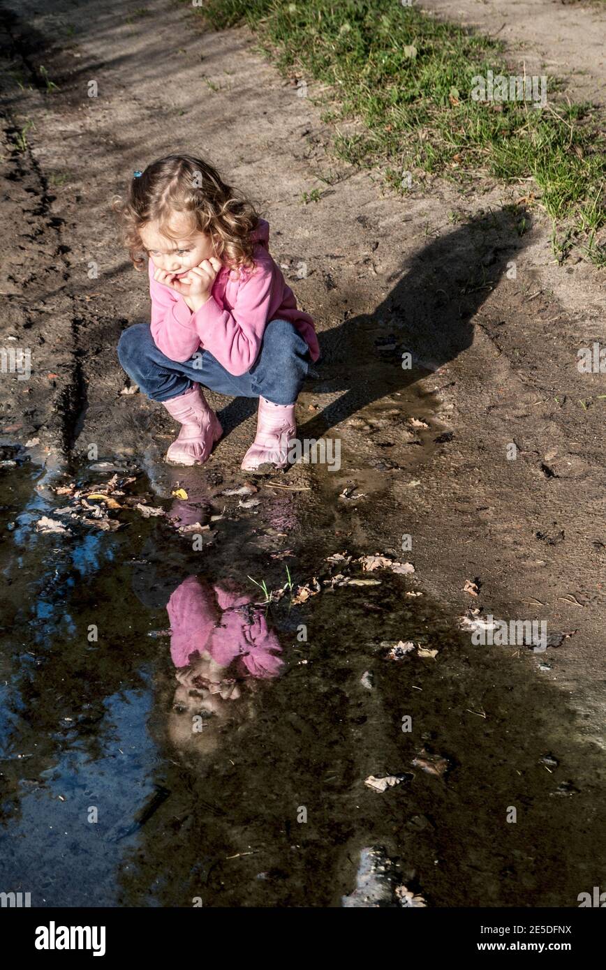 Puddle reflection child hi-res stock photography and images - Alamy