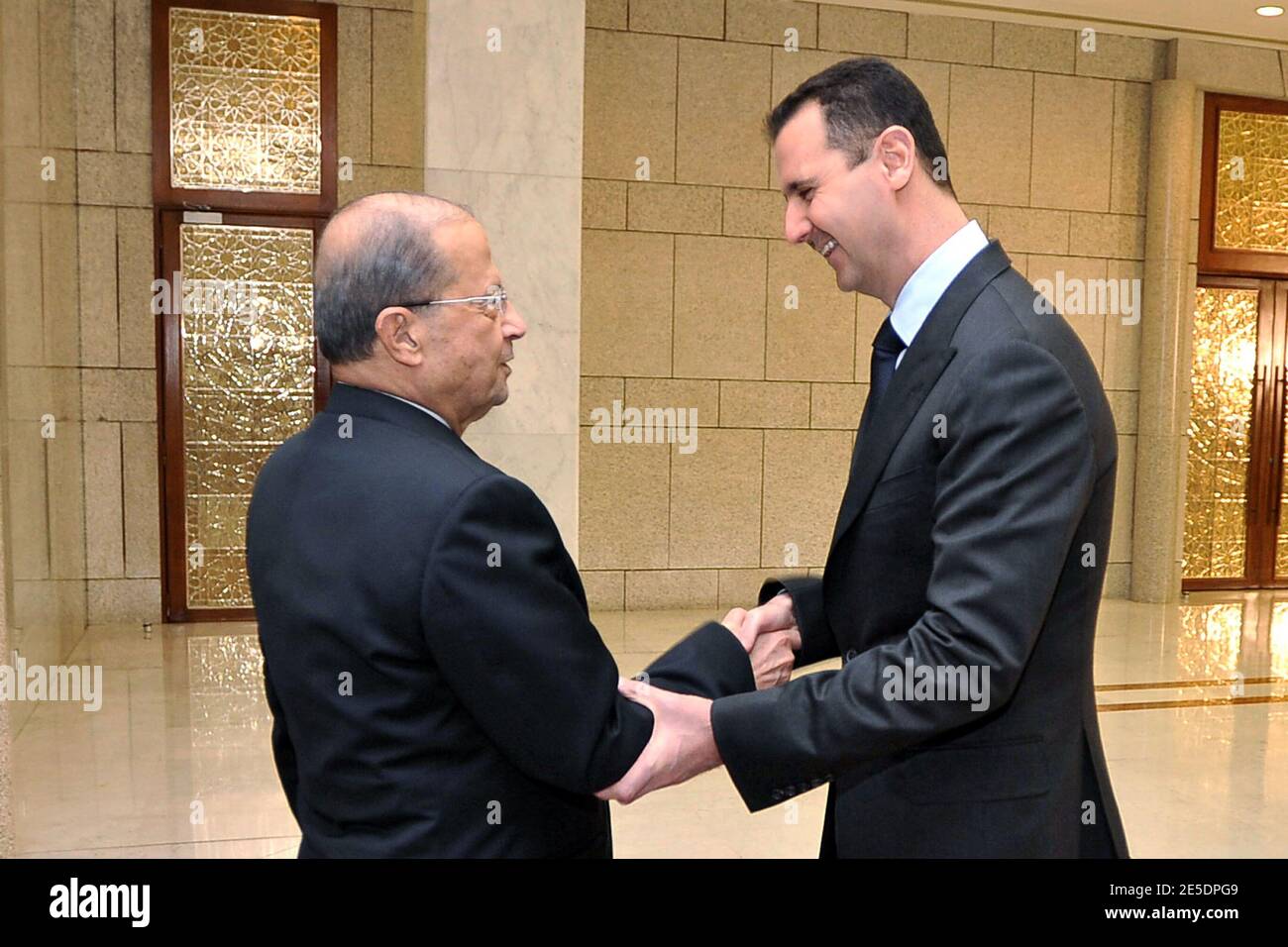 Syrian President Bashar Al Assad (R) receives hands Lebanese Christian ...