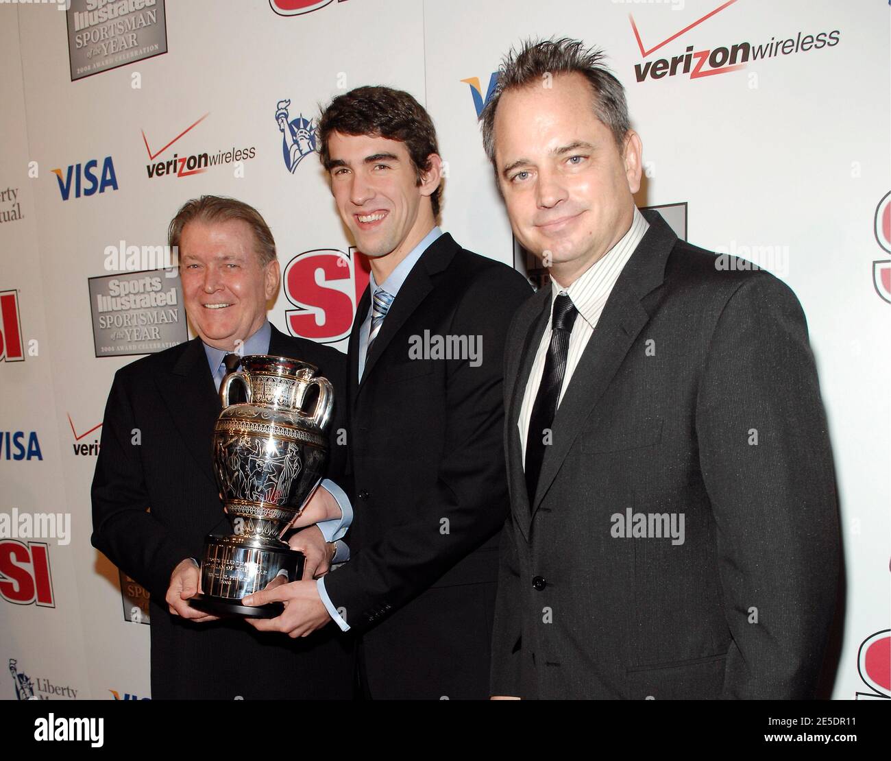 (L-R) Terry McDonell, Michael Phelps and Mark Ford pose at the 2008 ...