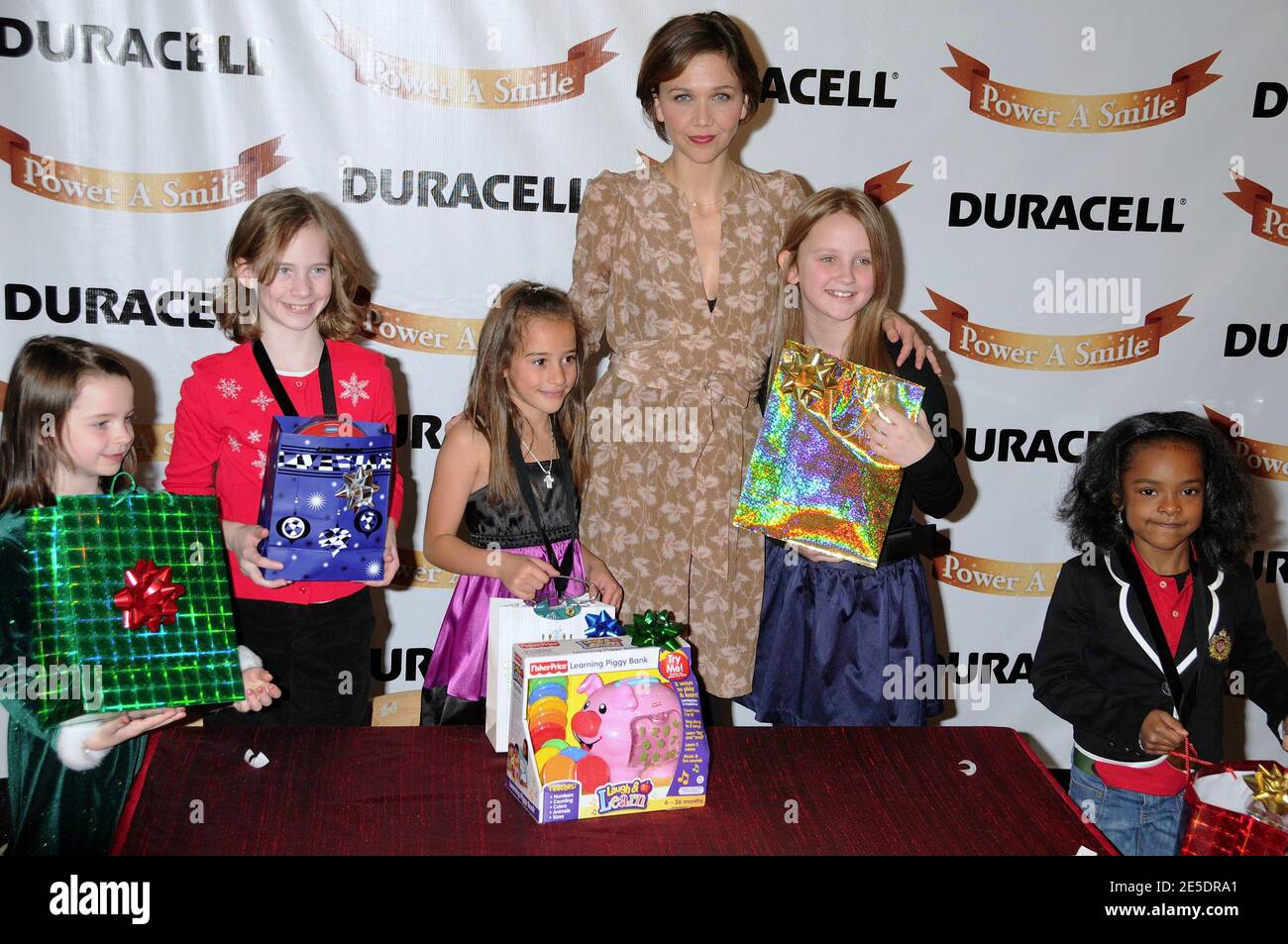 Actress Maggie Gyllenhaal and Youth Duracell Holiday Ambassadors (L-R ...